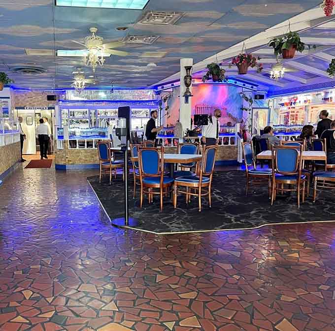 The spacious dining room with its unique flooring and ambient lighting creates the perfect setting for everything from date night to family celebrations.