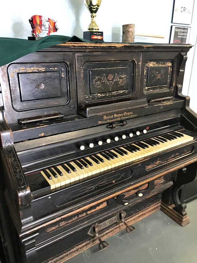 This weathered vintage piano has accompanied countless gatherings, celebrations, and quiet evenings, its keys holding memories of every song played.