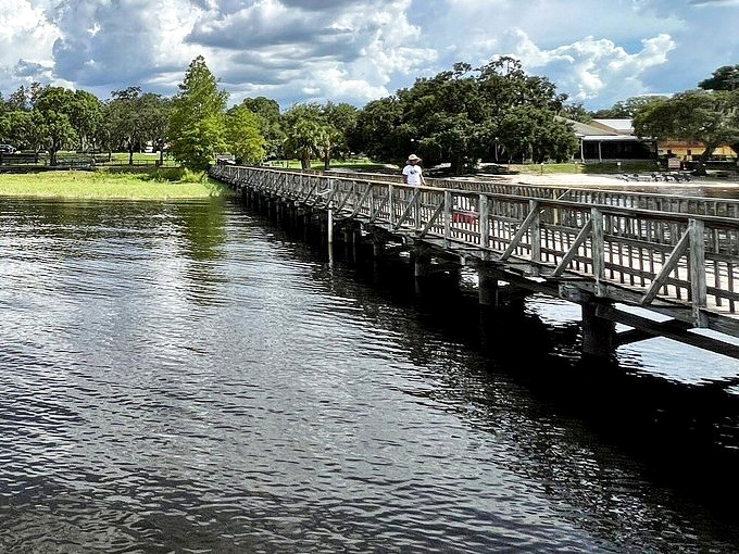 Lake Minneola sparkles beyond the village, reminding visitors that Florida's natural beauty has always been the real attraction here.