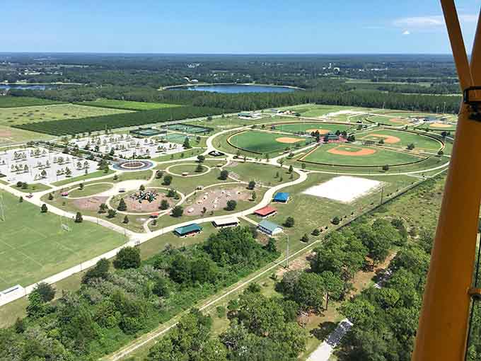 From above, the park's thoughtful design becomes clear: winding paths, multiple sports complexes, and enough green space to make you forget you're minutes from civilization.