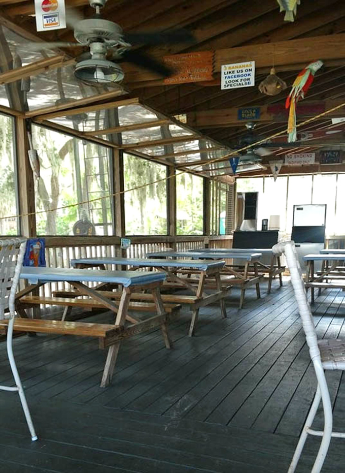 The screened porch offers lake views without Florida's unofficial state bird (the mosquito) &ndash; genius-level dining engineering at work.