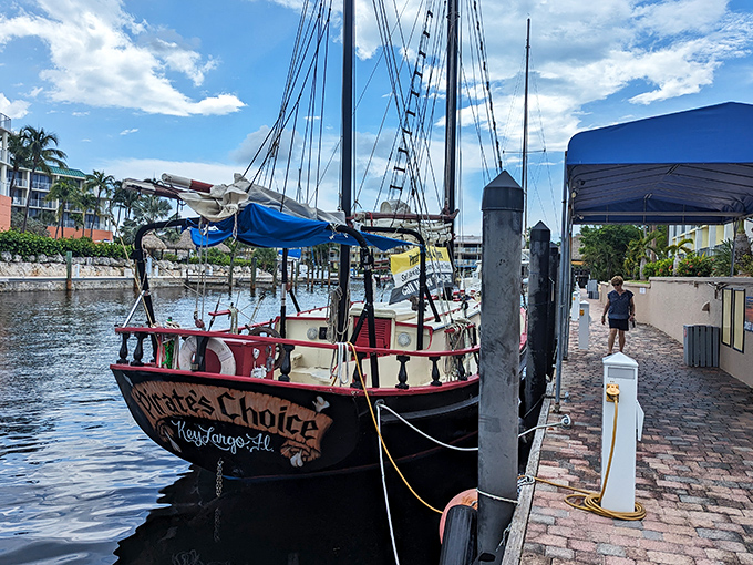 The Pirate's Choice, another vintage vessel, shares the marina with the more famous African Queen, creating a nautical time capsule.