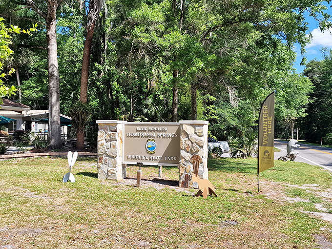The park's entrance sign promises adventures that deliver authentic Florida experiences without a single costumed character in sight.