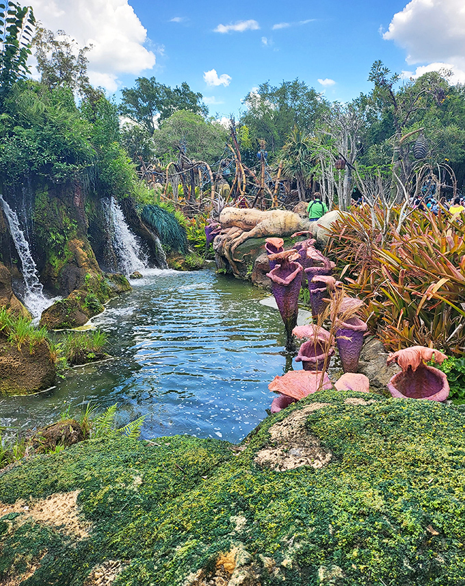 Nature's artwork unfolds as cascading waters create a refreshing oasis surrounded by exotic plants and hidden pathways for exploration.