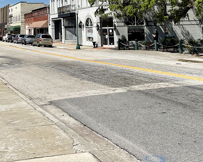 West Oak Street's storefronts invite exploration, their varied facades hinting at the eclectic treasures waiting inside for eagle-eyed antique hunters.