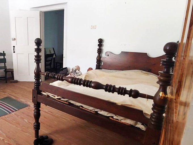 Colonial bedroom featuring furniture that makes your IKEA mattress seem like a cloud-based luxury suite from the future.