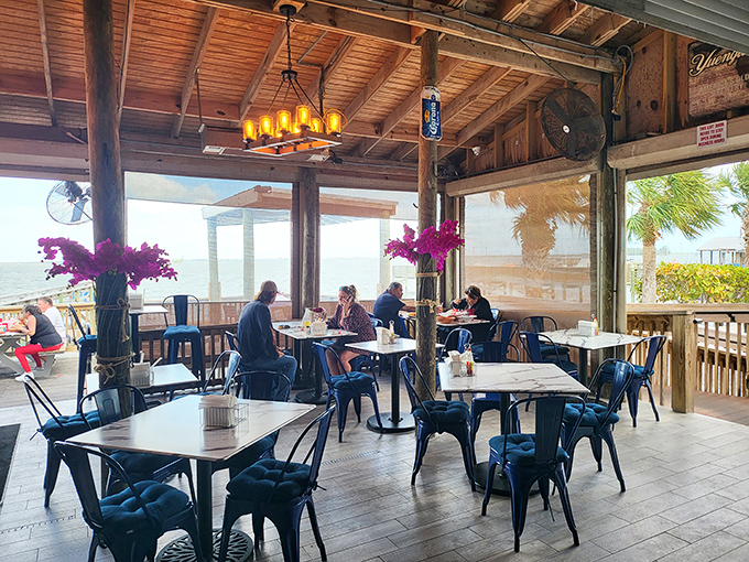 Sunlight streams through windows as guests enjoy their feast, the outside world momentarily forgotten in the pursuit of seafood perfection.