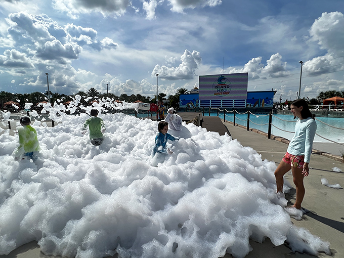 The foam party transforms ordinary swimming into an extraordinary bubble adventure, delighting kids who suddenly find themselves swimming in clouds.