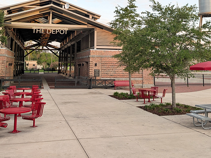 Red benches invite weary shoppers to rest and people-watch, turning a simple shopping trip into a social occasion.