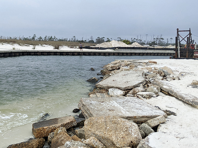 Jagged concrete meets gentle tide, creating an accidental sculpture garden where land and sea negotiate their ever-changing boundary.