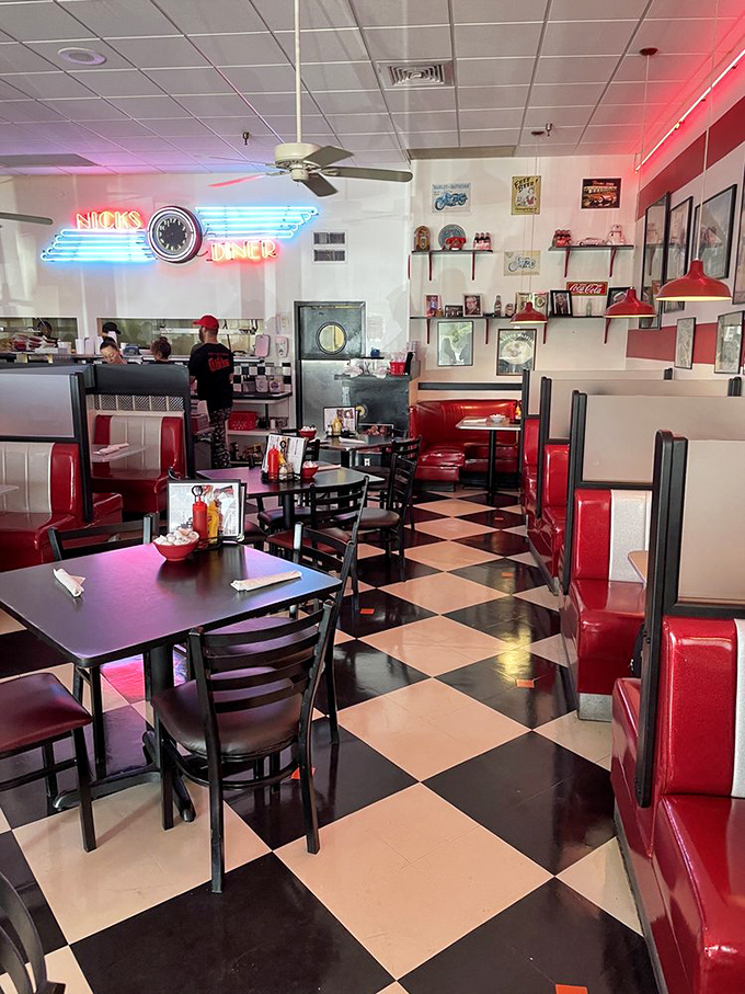 Red vinyl booths invite lingering conversations over endless coffee refills, while neon signs cast a warm glow over decades of diner memories.