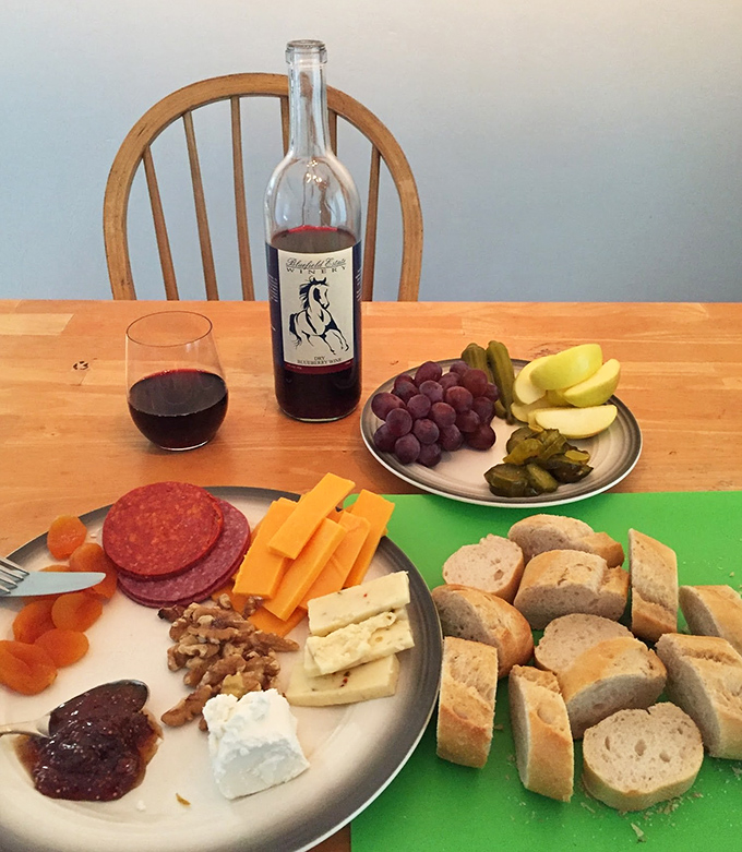 A perfect pairing! This spread of charcuterie, cheese, and fresh fruit creates the ideal companion for Bluefield's distinctive fruit wines.