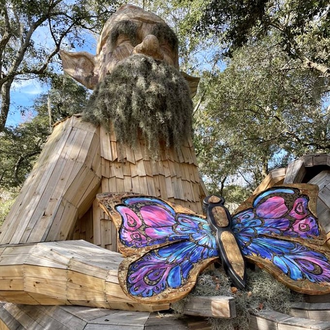 The wooden gnome sculpture stands as unofficial greeter and Instagram star of Folly Farm &ndash; high-five not included.