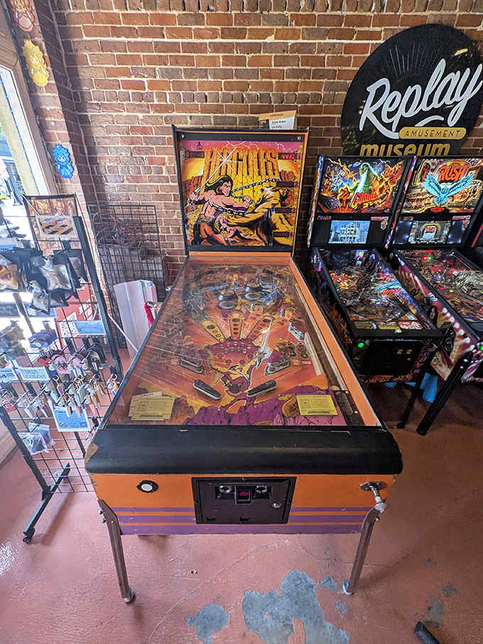 The legendary Hercules pinball machine towers over its neighbors, its oversized design making it a must-play attraction for pinball enthusiasts.