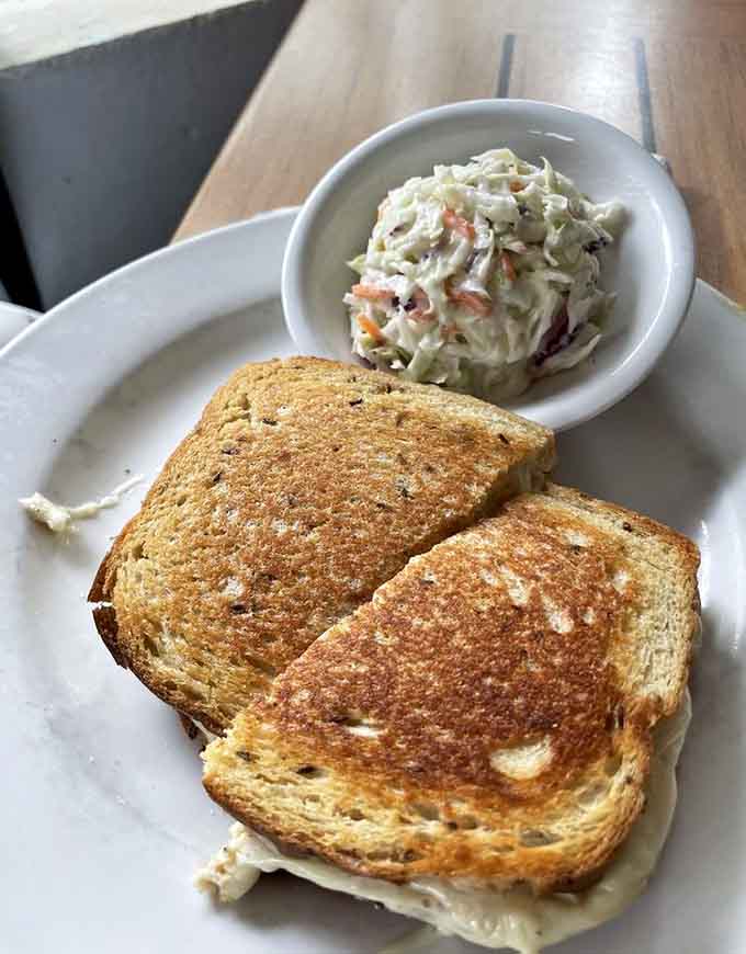 That golden-brown tuna melt with coleslaw is classic diner fare executed perfectly, proving simple food done right never goes out of style.