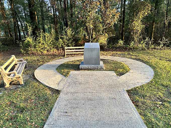 The monument marking Florida's highest natural point sits in quiet dignity, a granite testament to the state's commitment to celebrating even its most modest geographical features.