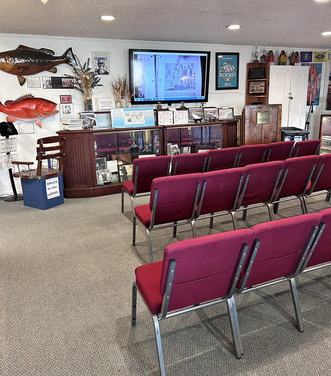 The intimate theater space offers comfortable seating for videos that bring Destin's past to life.