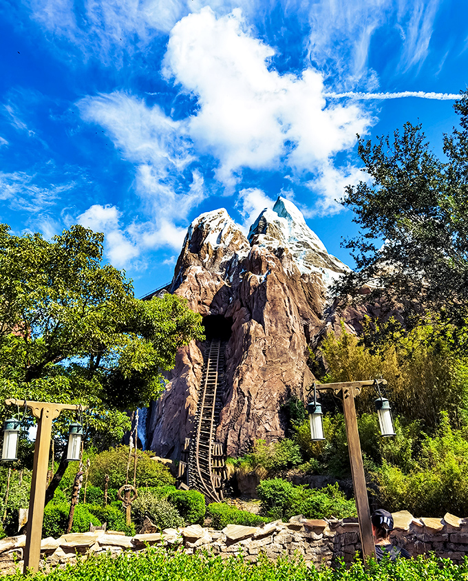 Expedition Everest towers majestically against blue skies, promising brave adventurers a heart-pounding journey into the realm of the legendary Yeti.