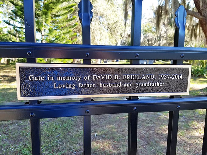 Memorial plaques honor those who loved this place enough to ensure its preservation, their own legacy now part of the cemetery's story.
