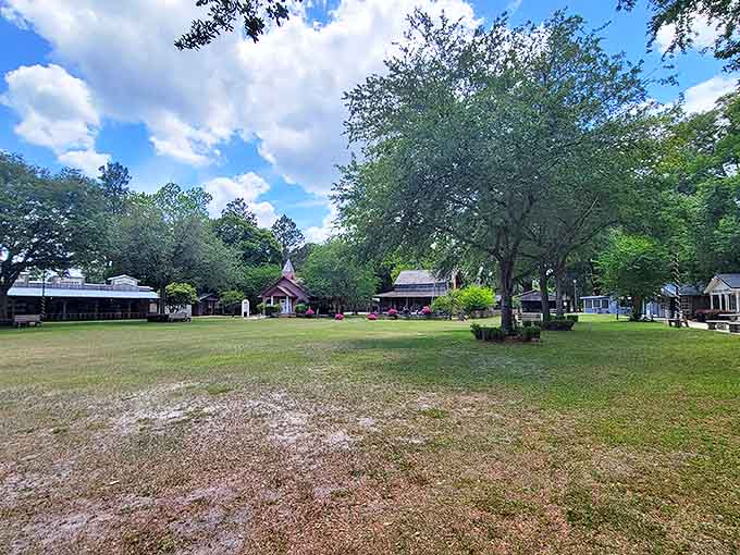Take in the wide-open views of the village green, surrounded by historic buildings and lush trees under a bright sky.