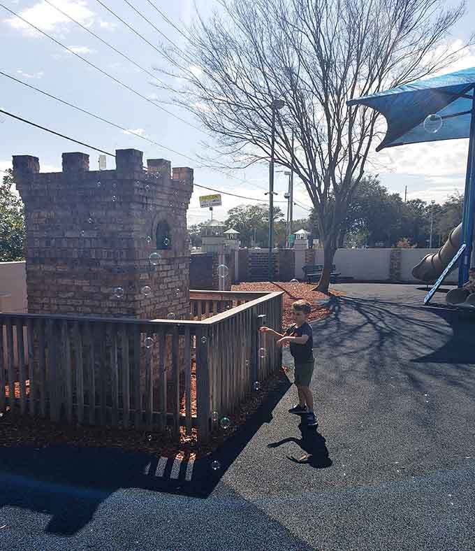 A miniature castle tower proving that every kid deserves to feel like royalty, even if their kingdom is made of playground equipment.