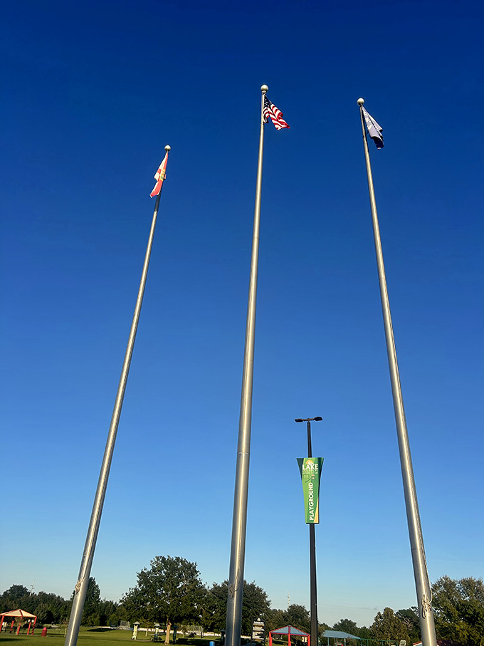 Three flags flying high over the park, a patriotic reminder that great community spaces are as American as baseball, apple pie, and arguing about barbecue techniques.