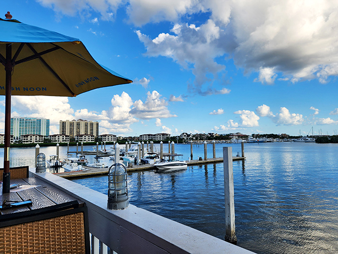 The view that sells a thousand meals&mdash;tranquil waters, moored boats, and the kind of sky that makes amateur photographers look professional.