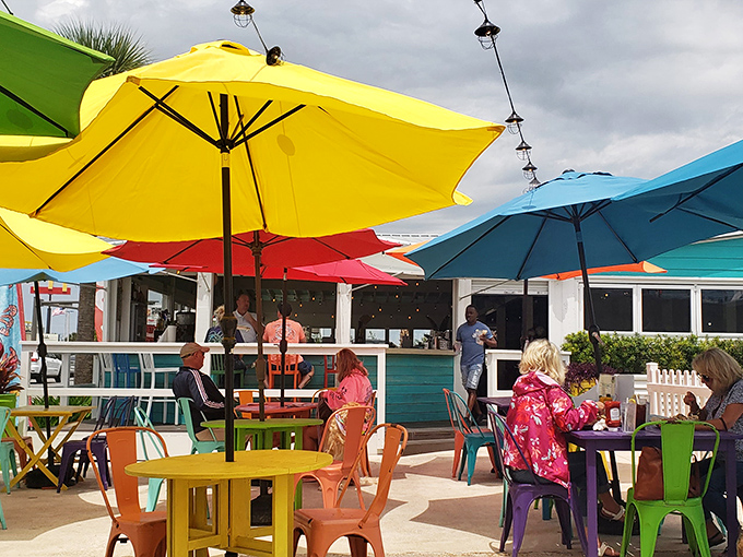 Under a canopy of colorful umbrellas, diners soak up Florida sunshine and sea breezes along with their seafood specialties.