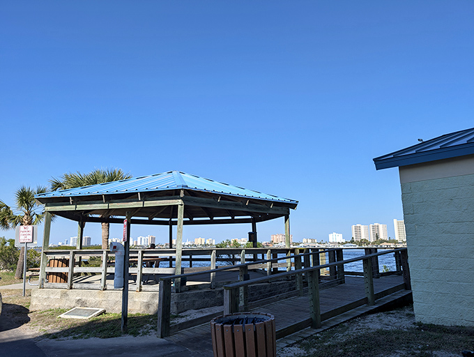 The covered pavilion offers respite from Florida's enthusiastic sunshine, creating the perfect spot for family gatherings where memories outshine the heat.