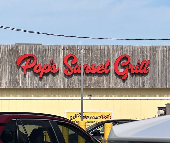 That iconic red script against weathered wood &ndash; a beacon for hungry travelers and a landmark for locals giving directions: "You can't miss it!"