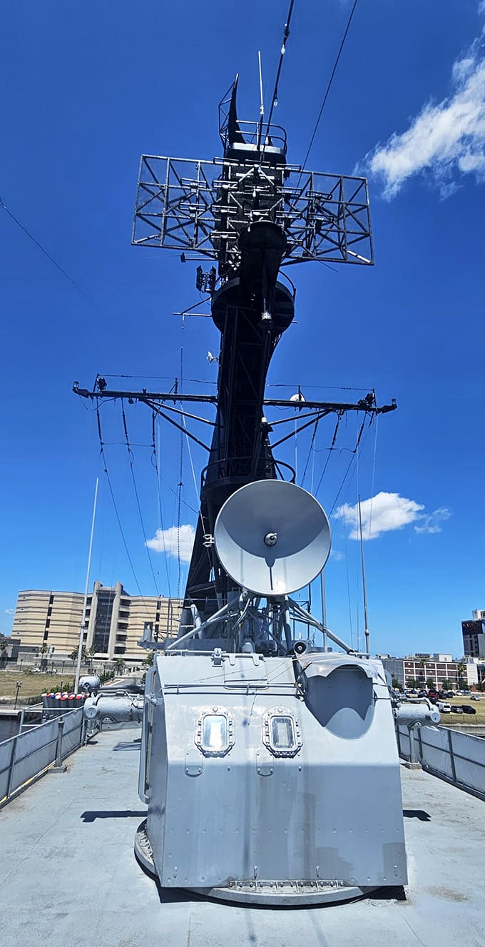The mainmast rises against blue Florida skies, topped with radar and communication arrays that were cutting-edge technology decades ago.
