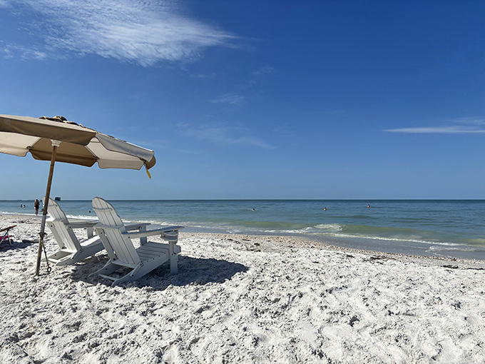 Adirondack chairs await sunset admirers, perfectly positioned for Treasure Island's nightly sky show that never fails to impress.