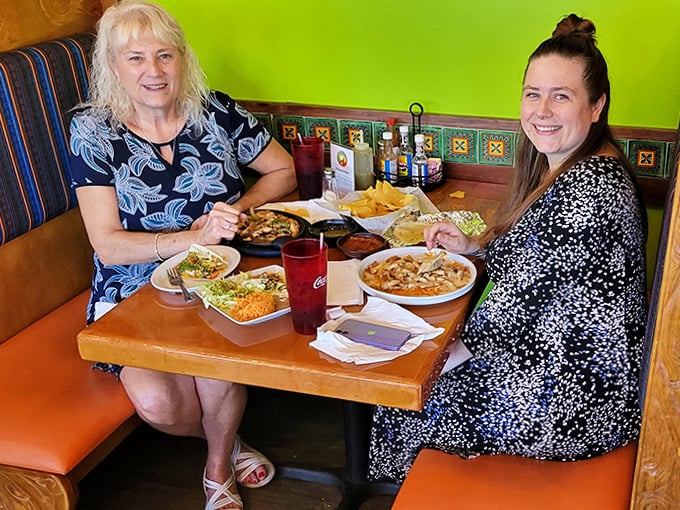 Happy diners sharing multiple dishes &ndash; the true test of any great restaurant is the joy on customers' faces mid-bite.