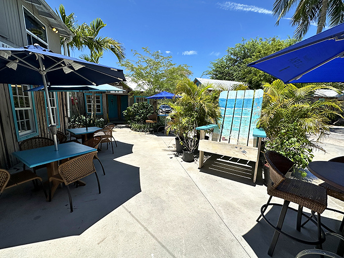 The outdoor patio doesn't just offer fresh air&mdash;it provides a tropical sanctuary where palm fronds filter the sunshine and conversations flow as easily as the breeze.