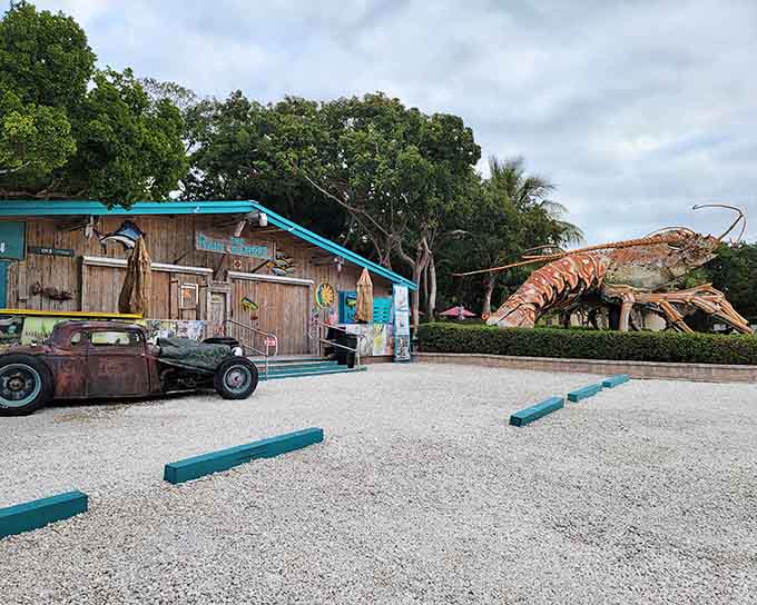 The parking area view shows how Betsy dominates the landscape, her massive form visible from the road and drawing curious travelers into her world.