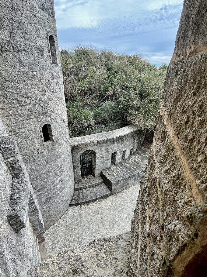 The curved stone passage reveals the castle's secrets one step at a time, like a medieval mystery novel.