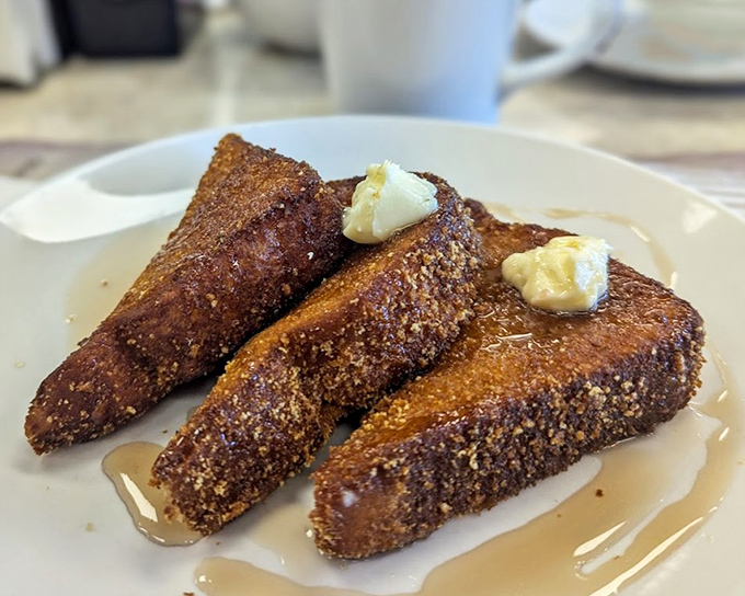 French toast that's actually French-toast-shaped, not those sad thin slices, glistening with butter and ready for its maple bath.