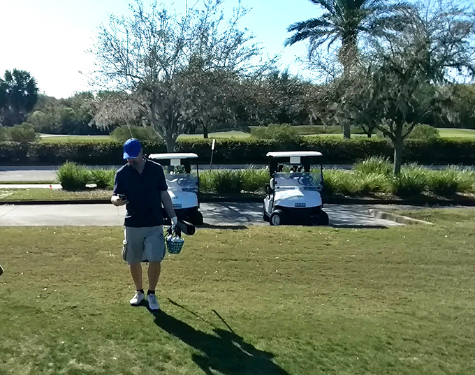 Golf carts stand ready for adventure, their white chariots promising to carry you through 18 holes of triumph, tragedy, and everything in between.