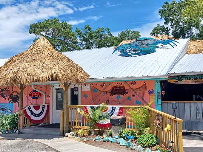 Colorful crab decorations and thatched roofs announce that this little pink building takes its seafood seriously but itself not at all.