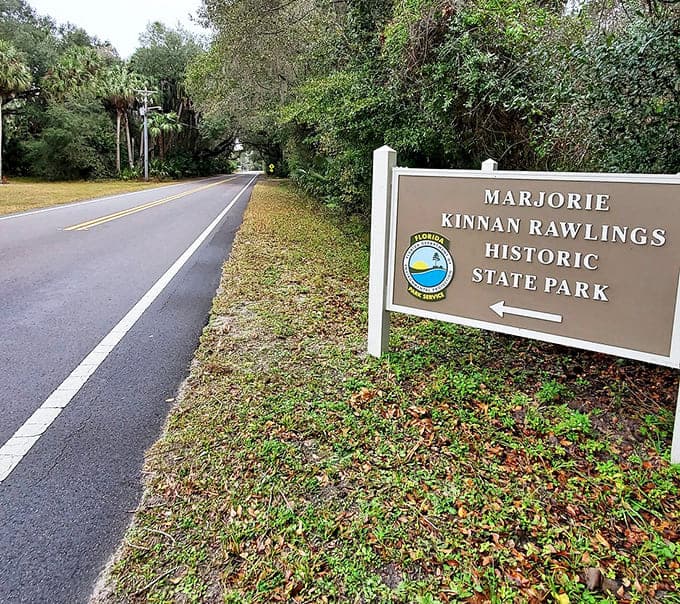That unassuming roadside sign marks the entrance to literary history, where Florida's wild heart found its most eloquent voice.