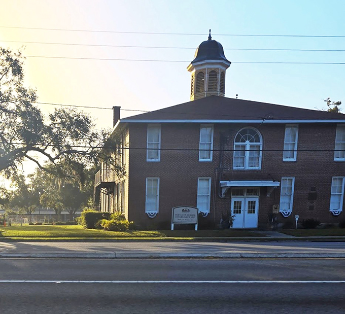 Dawn's early light casts a warm glow on the Old Lutz Schoolhouse, a quiet moment before another day of sharing history.