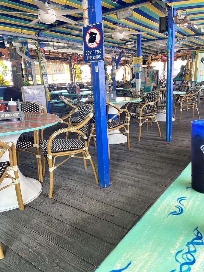 Colorful outdoor seating invites you to linger longer, where every table offers a different perspective on paradise found at Porky's Bayside BBQ.
