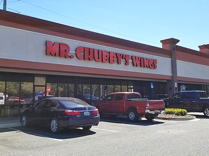 The starting line for your flavor journey, where anticipation builds with each step toward those red letters. Your car will smell like wings for days—consider it a souvenir.