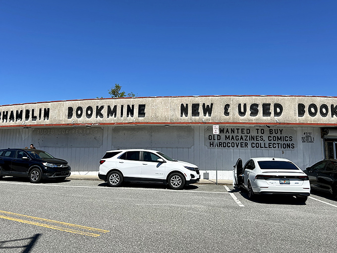 The exterior view from the parking lot, where cars wait patiently while their owners lose track of time inside.