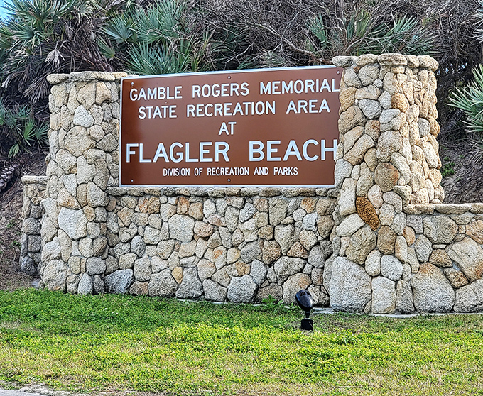 The stone sentinel announces your arrival to old Florida. This entrance sign promises authentic experiences beyond the tourist traps.