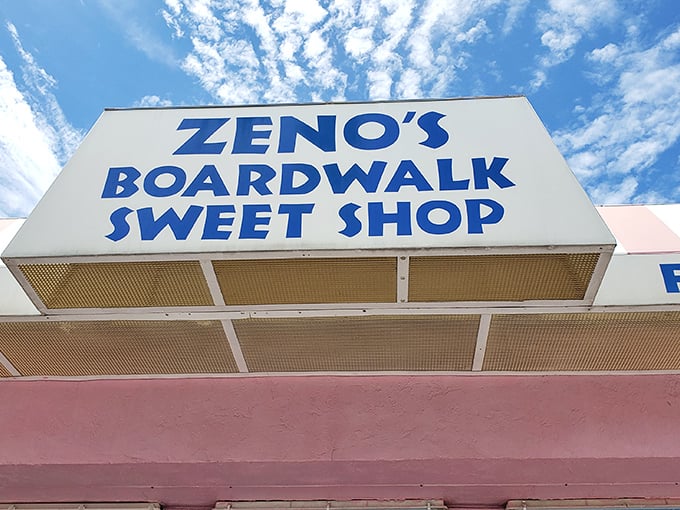 The bold blue lettering of Zeno's sign stands out against the Florida sky – a beacon for sweet-toothed travelers seeking authentic boardwalk treasures.