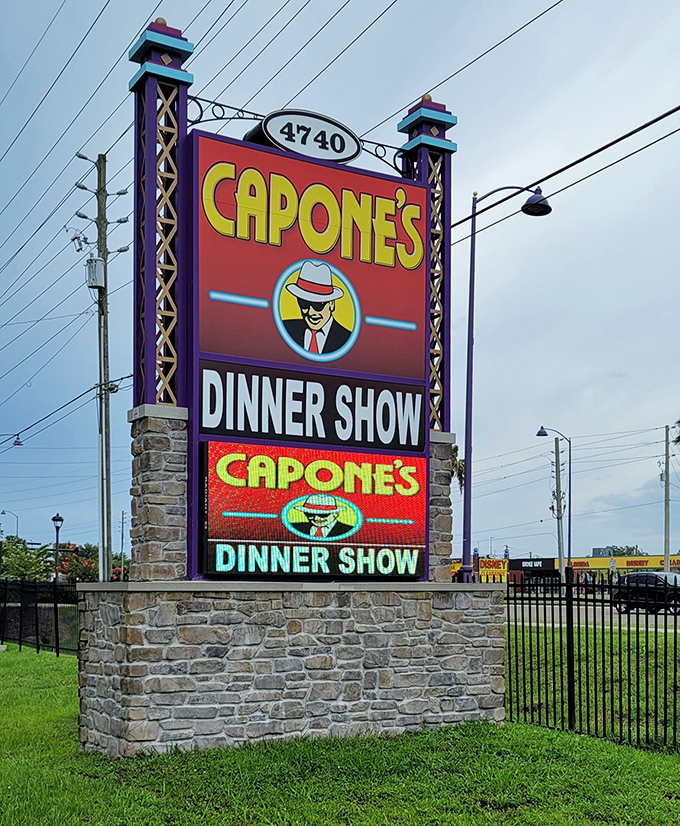 The vibrant roadside sign stands as a beacon for those seeking a night of nostalgic entertainment amid Orlando's modern attractions.