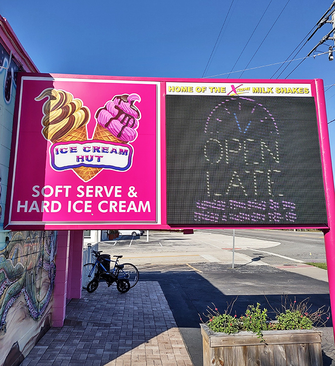 The digital sign alternates between temperature displays and tempting treat images – as if the vibrant building alone wasn't enough to lure you in.