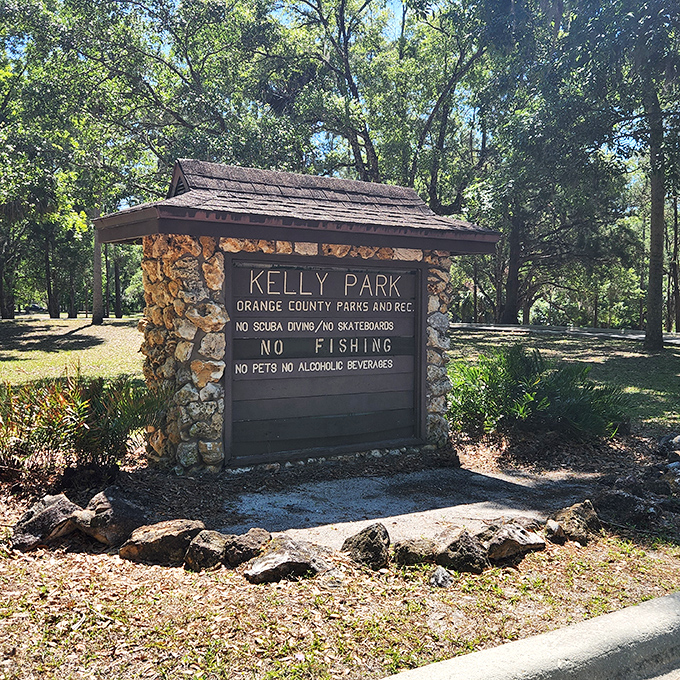 Kelly Park's entrance sign lists the rules, because even paradise needs some guidelines to stay heavenly.