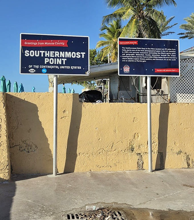 The sign marks the spot with the precision of someone who really wants you to know exactly where you're standing, just in case you forgot.